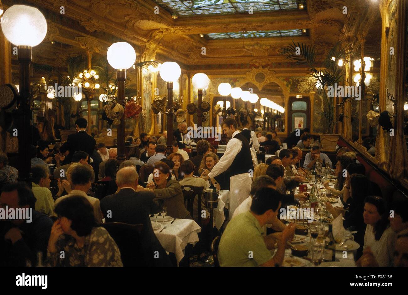 People enjoying in restaurant Julien in the Art Nouveau style Stock ...