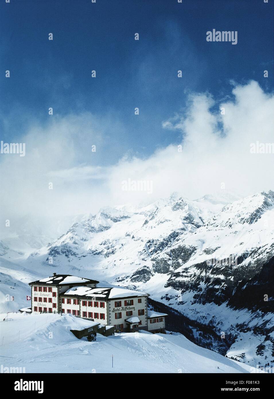 View of hotel in snow capped mountains, Valais, Switzerland Stock Photo ...