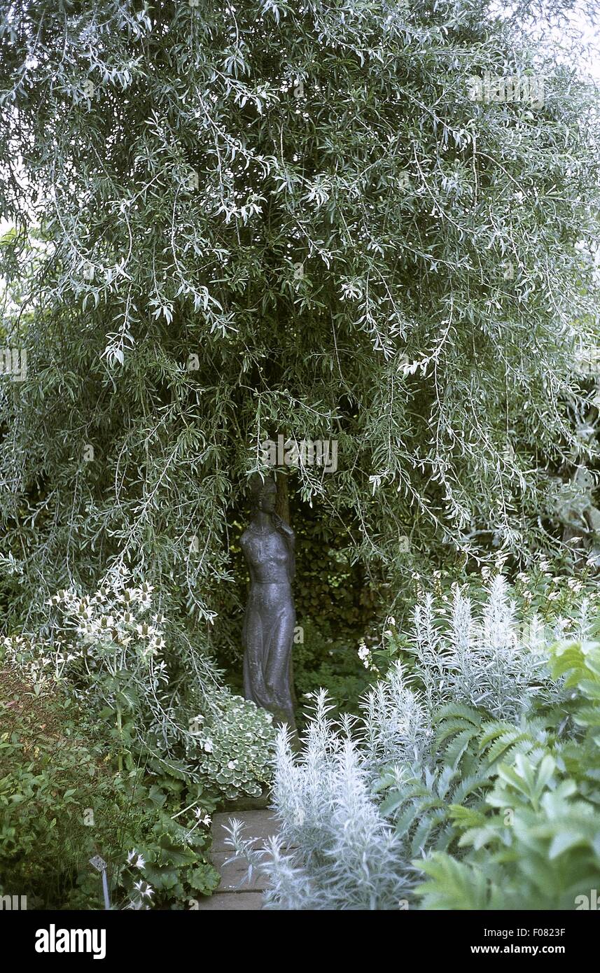 Statue under tree at Sissinghurst Castle Garden Stock Photo - Alamy
