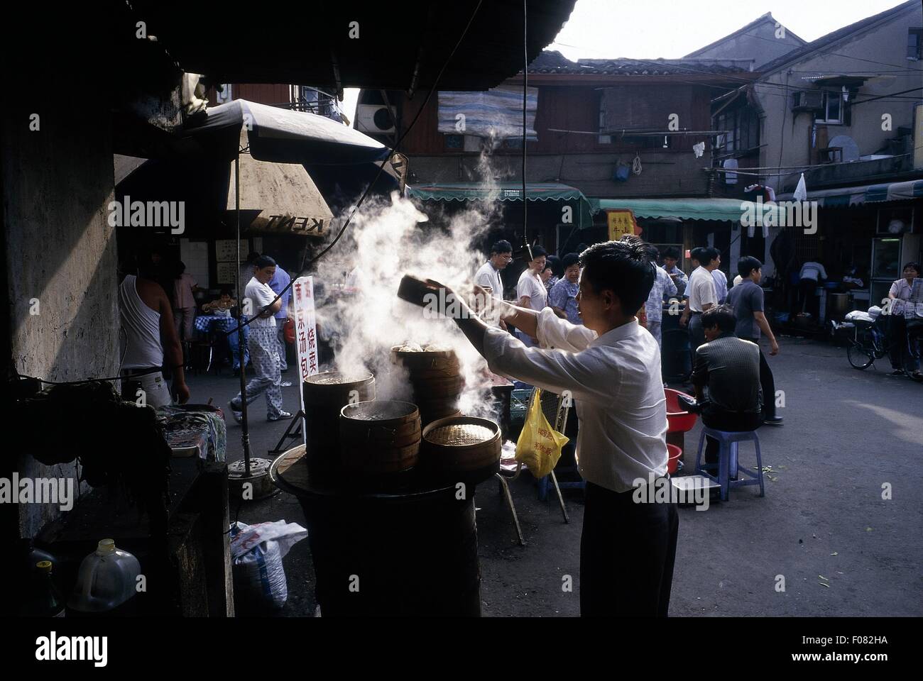 Food stall with steaming pots on street in Shanghai Stock Photo - Alamy