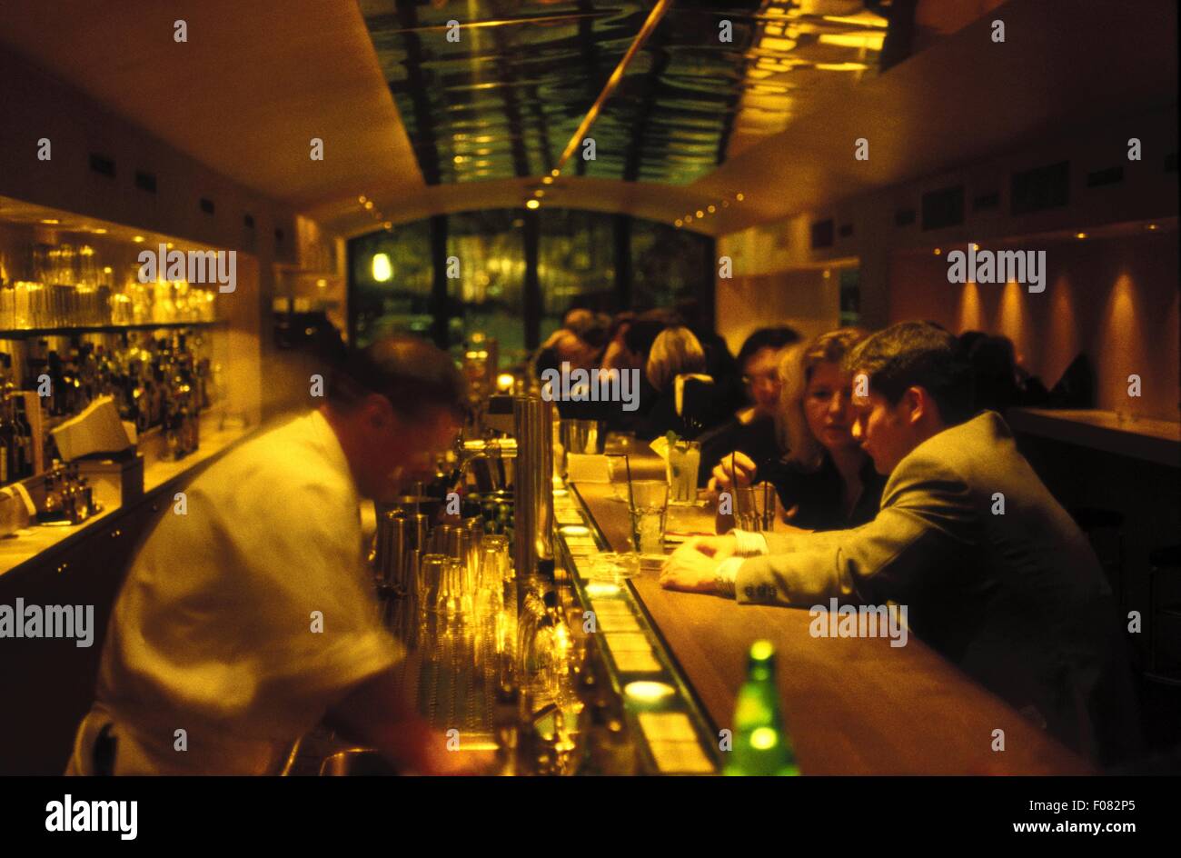 Guests at bar counter in Berlin, Germany Stock Photo - Alamy