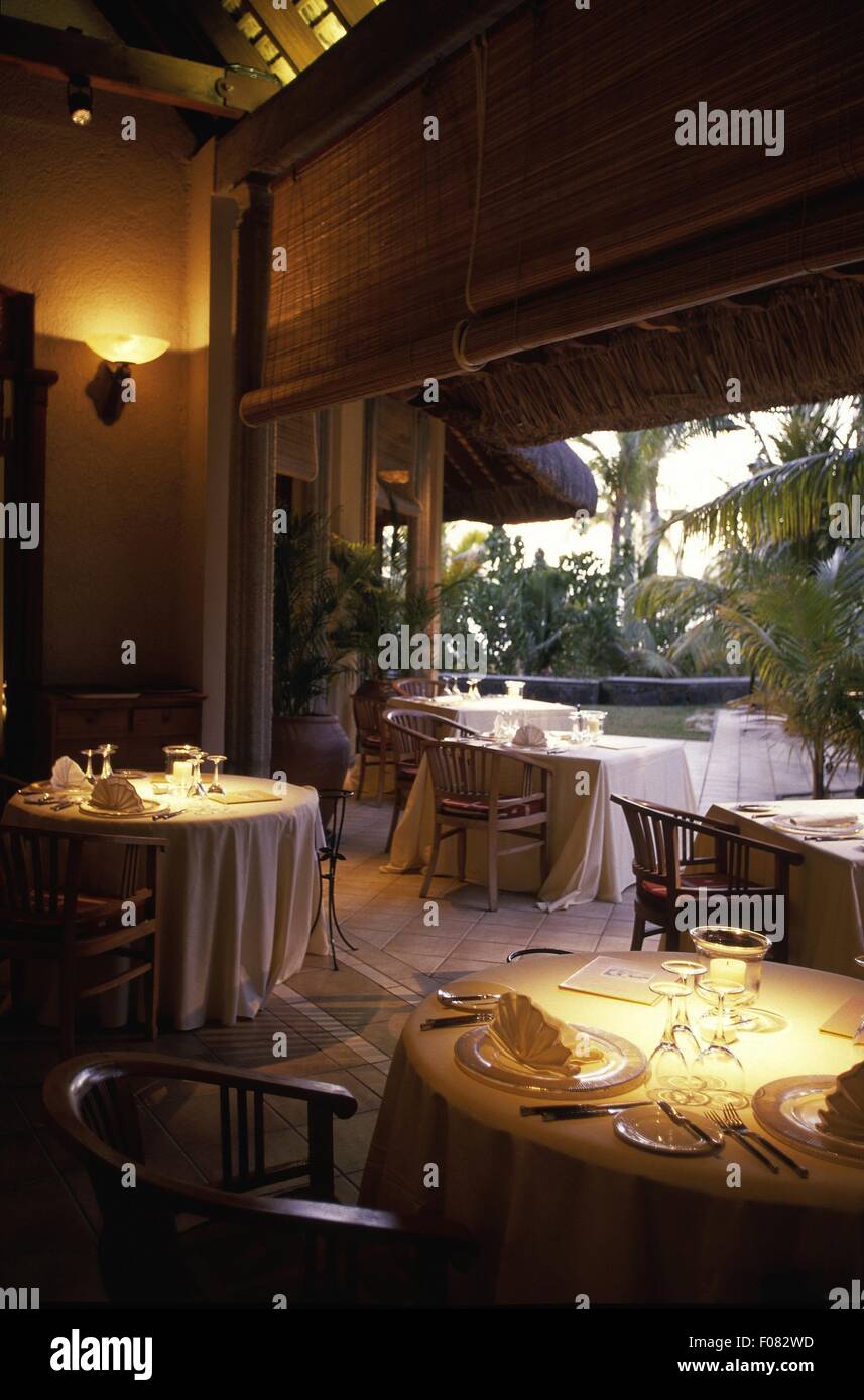 Tables laid in Hotel Dinarobin, Mauritius Stock Photo - Alamy