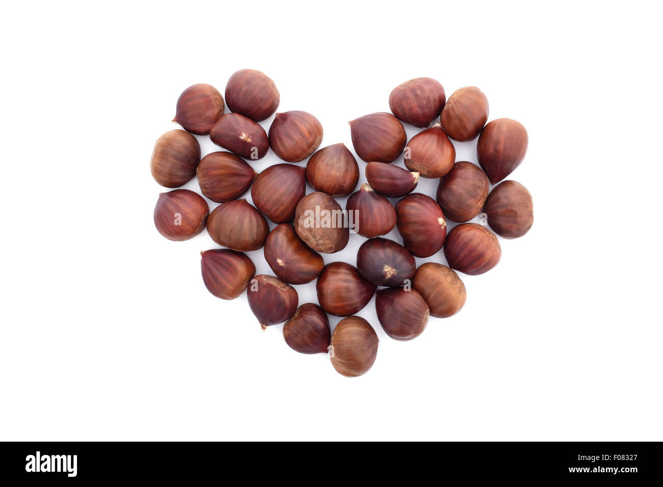 Chestnuts in a heart shape, isolated on a white background Stock Photo ...