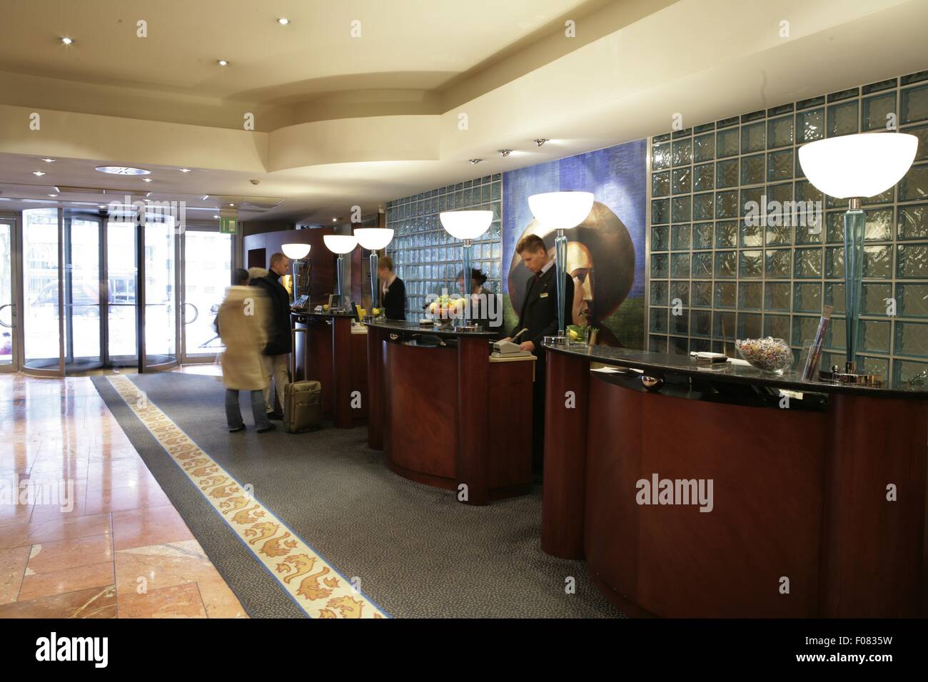 Guests at reception of hotel, Germany Stock Photo - Alamy
