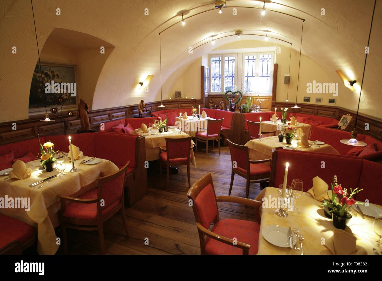 Interior of restaurant with illuminated dining tables, Germany Stock ...