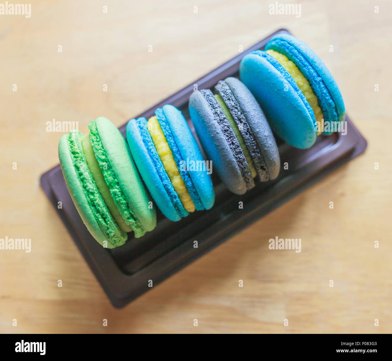 Colorful macarons on plastic tray with vintage pastel filtered Stock ...