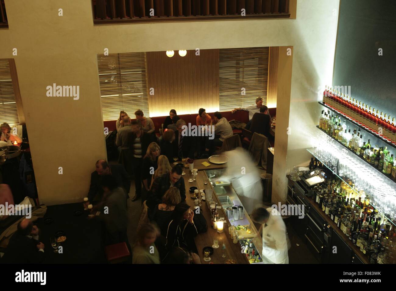 People at bar counter of restaurant, Germany Stock Photo - Alamy