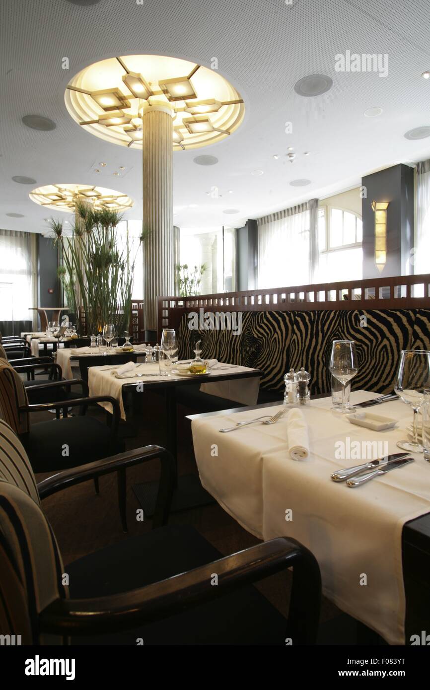 Tables laid in restaurant, Switzerland Stock Photo - Alamy