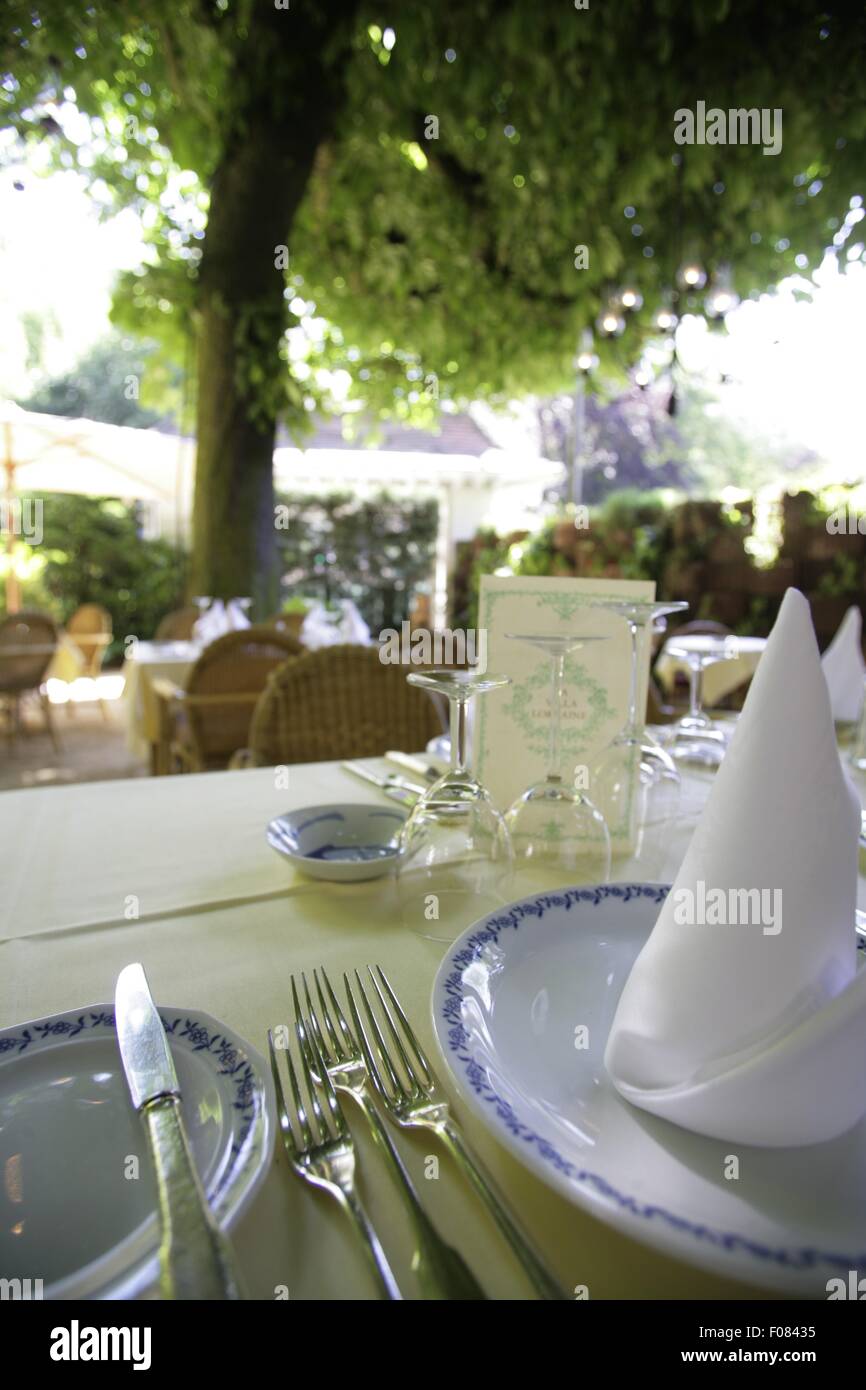 Tables laid in restaurant, Austria Stock Photo - Alamy