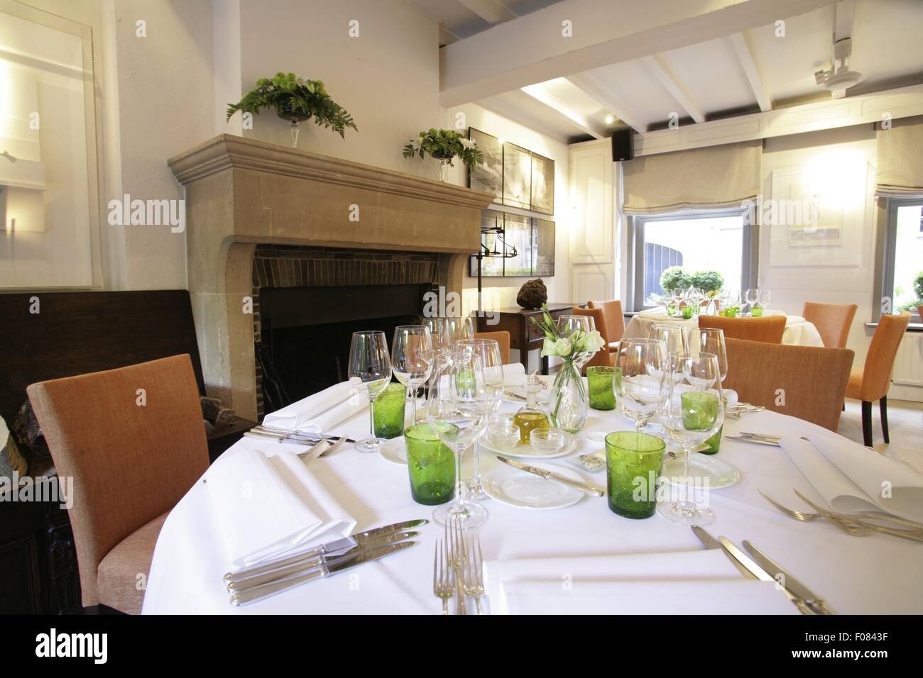 Tables laid in restaurant, Belgium Stock Photo - Alamy