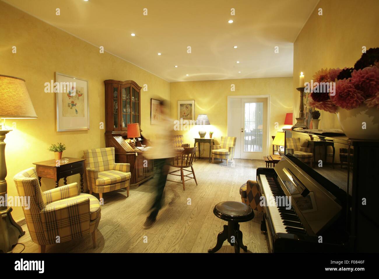 Room with piano, tables and chairs in hotel Stock Photo - Alamy