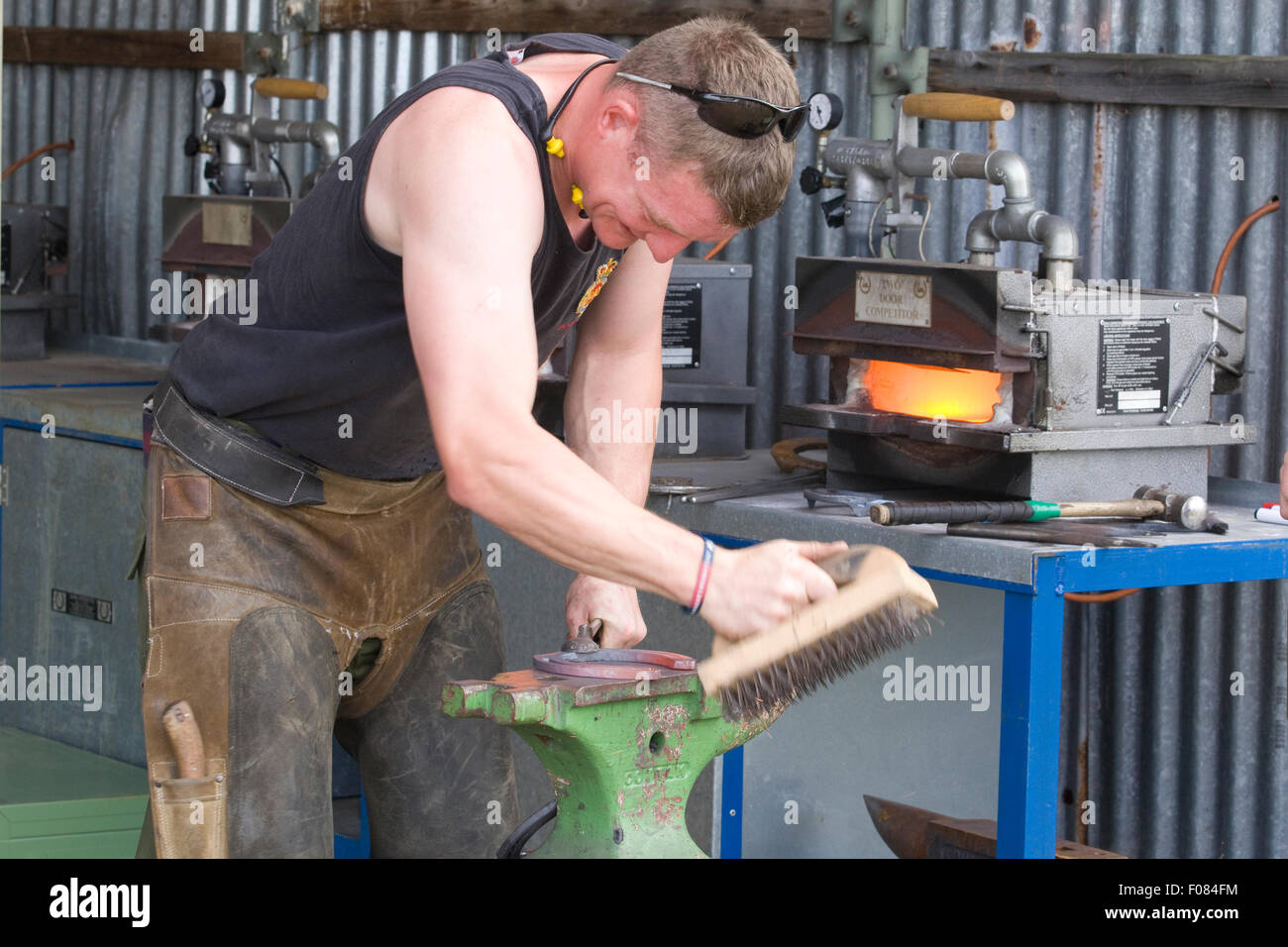 soldier making a reed Doll with traditionally dressed children from the ...