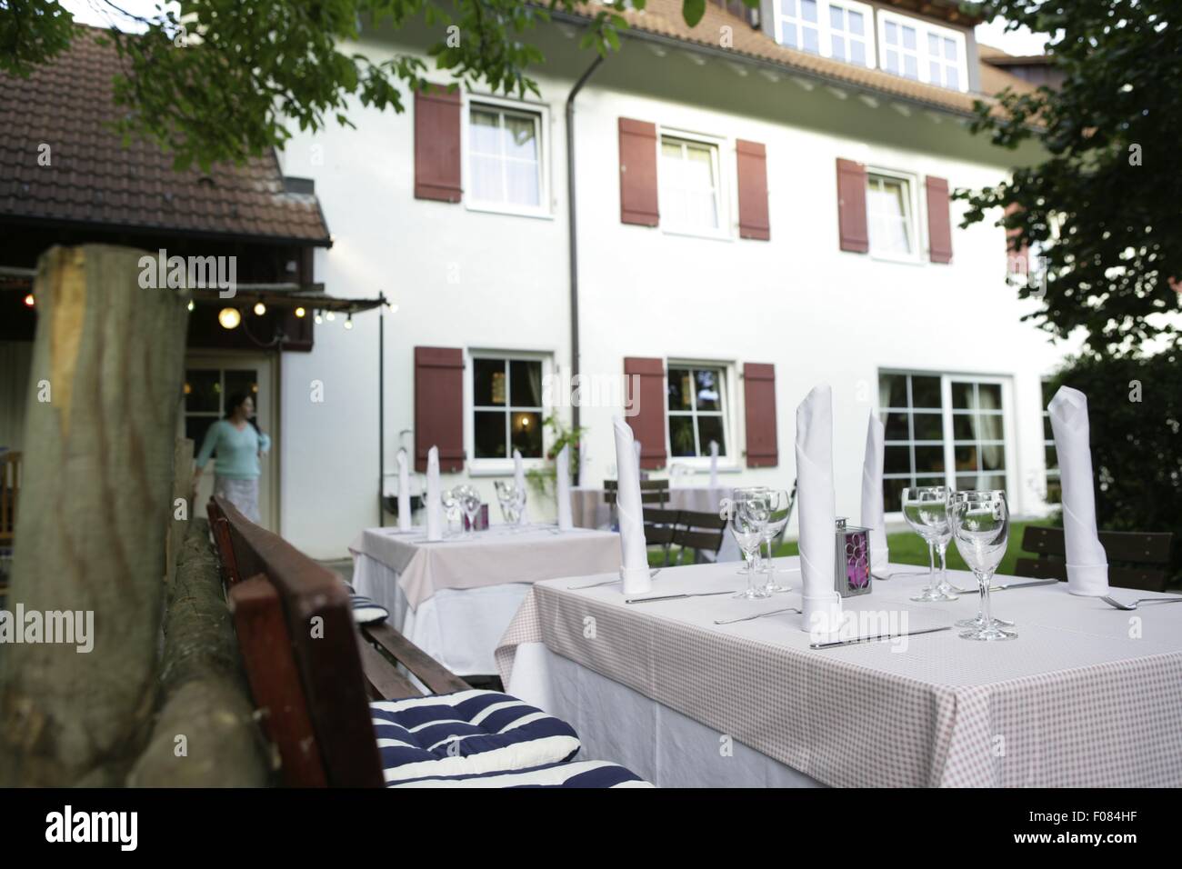 Tables laid outside restaurant, Germany Stock Photo - Alamy