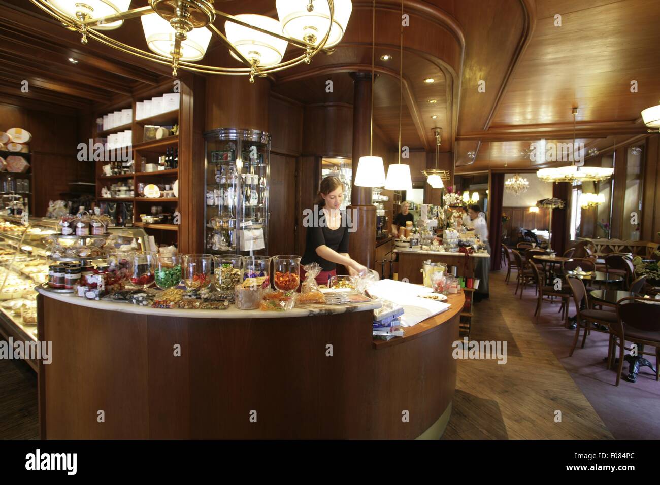 Woman working at counter of café, Germany Stock Photo - Alamy