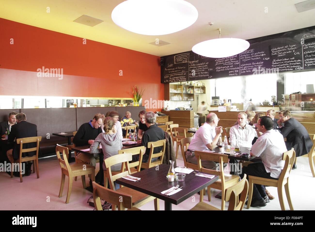 People sitting at table in restaurant, Germany Stock Photo - Alamy