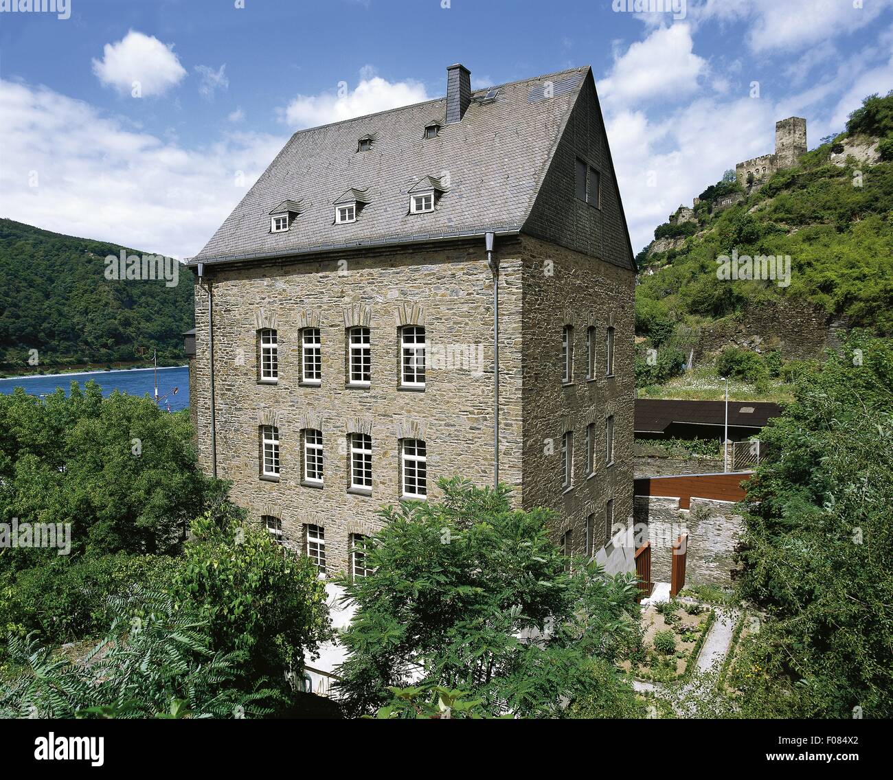 Three-stored stone house with pointed roof in Reihnufer Stock Photo - Alamy