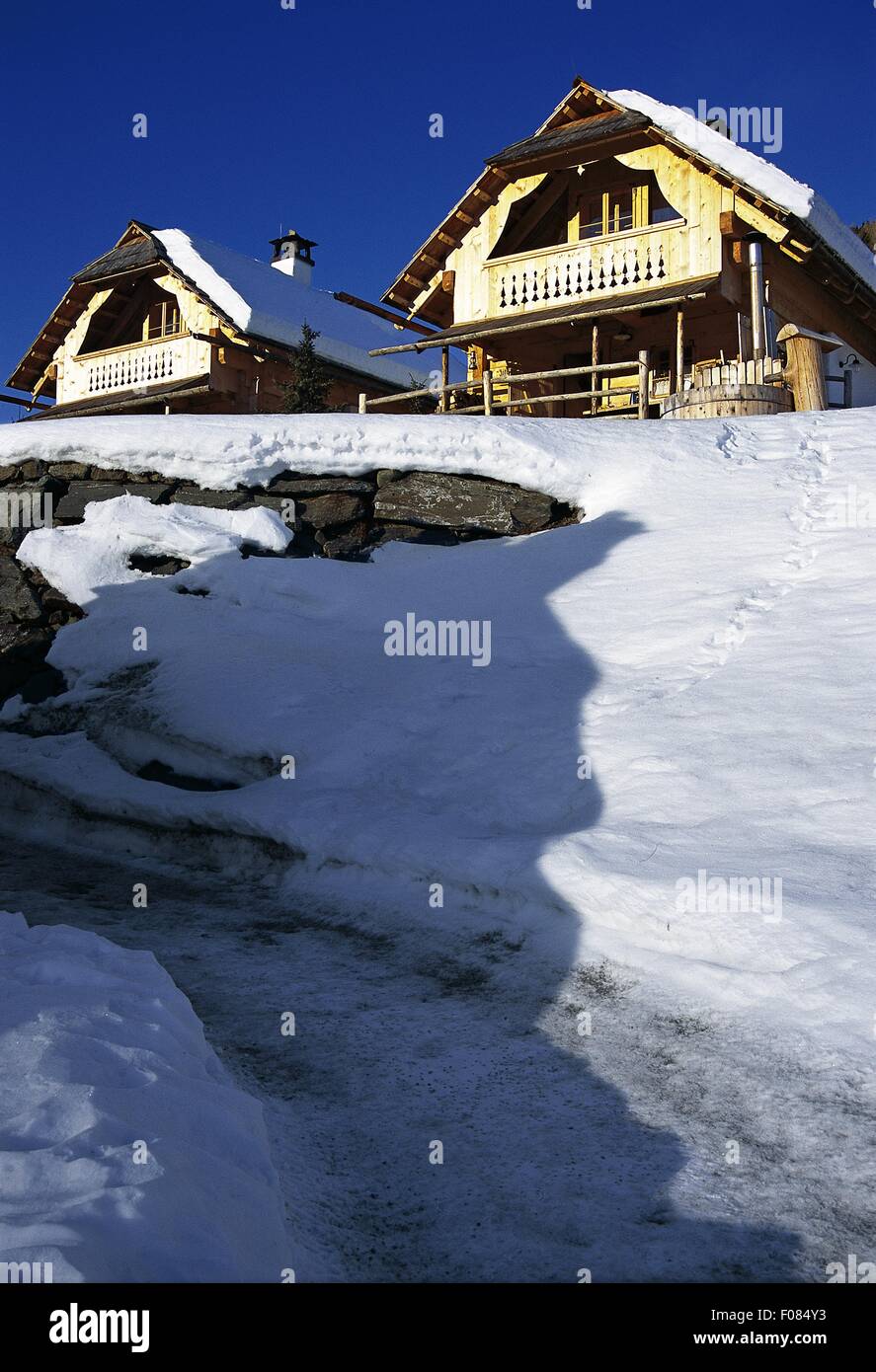Alpine huts covered with snow in winter Stock Photo - Alamy