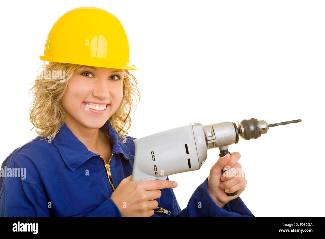 Happy female worker with a drilling machine Stock Photo - Alamy