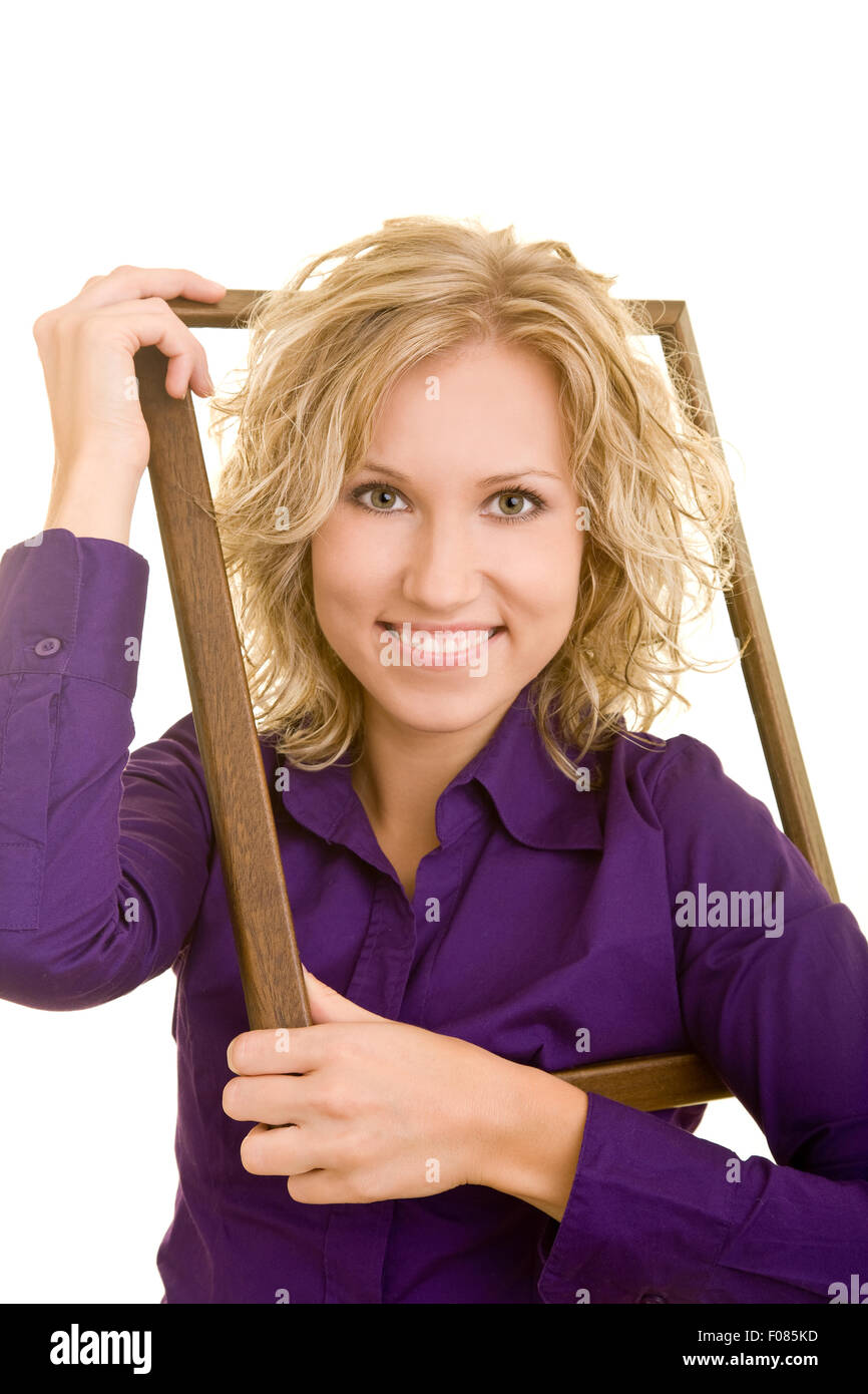 Happy woman climbing through an empty picture frame Stock Photo - Alamy