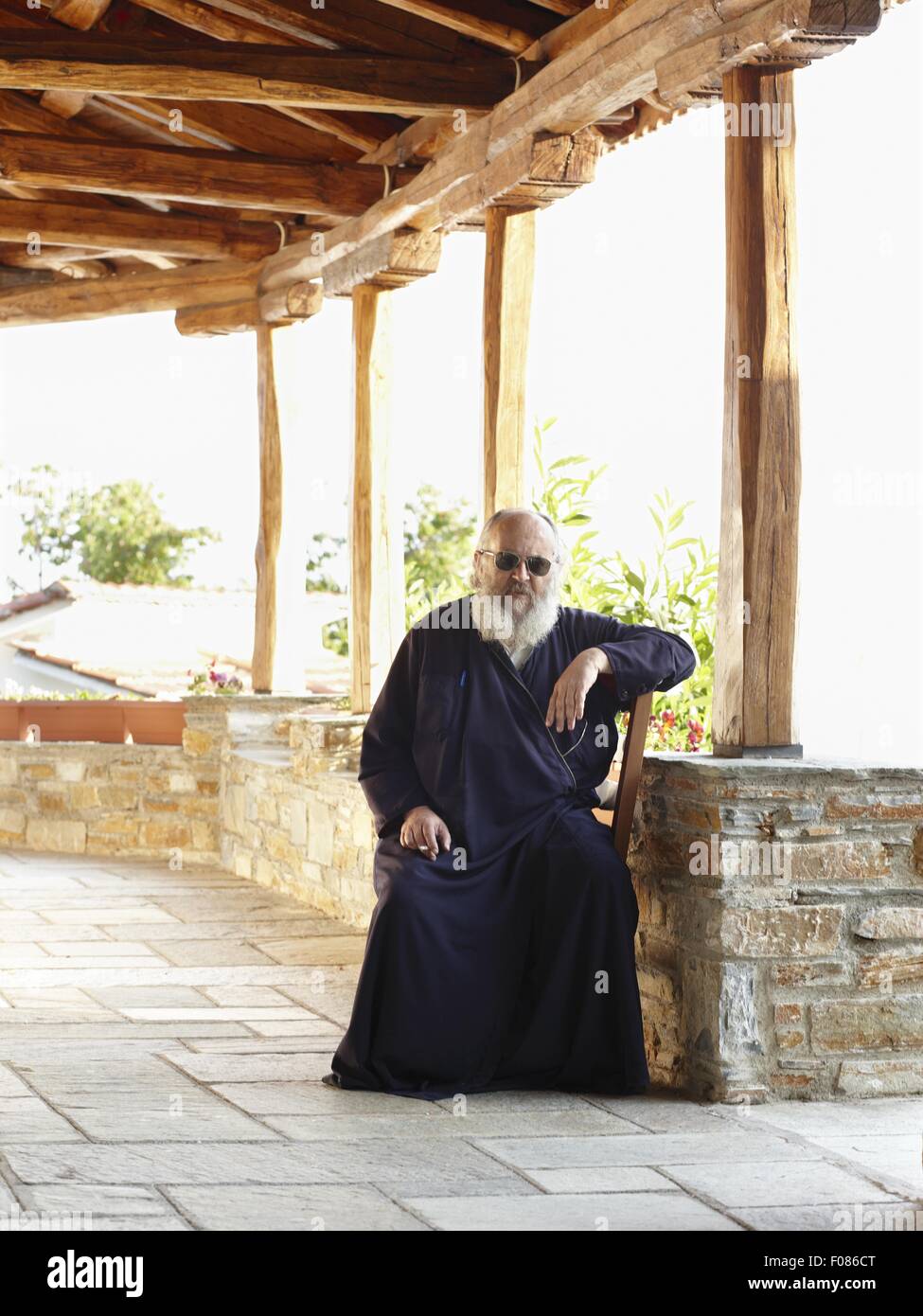 Sitting priest hi-res stock photography and images - Alamy