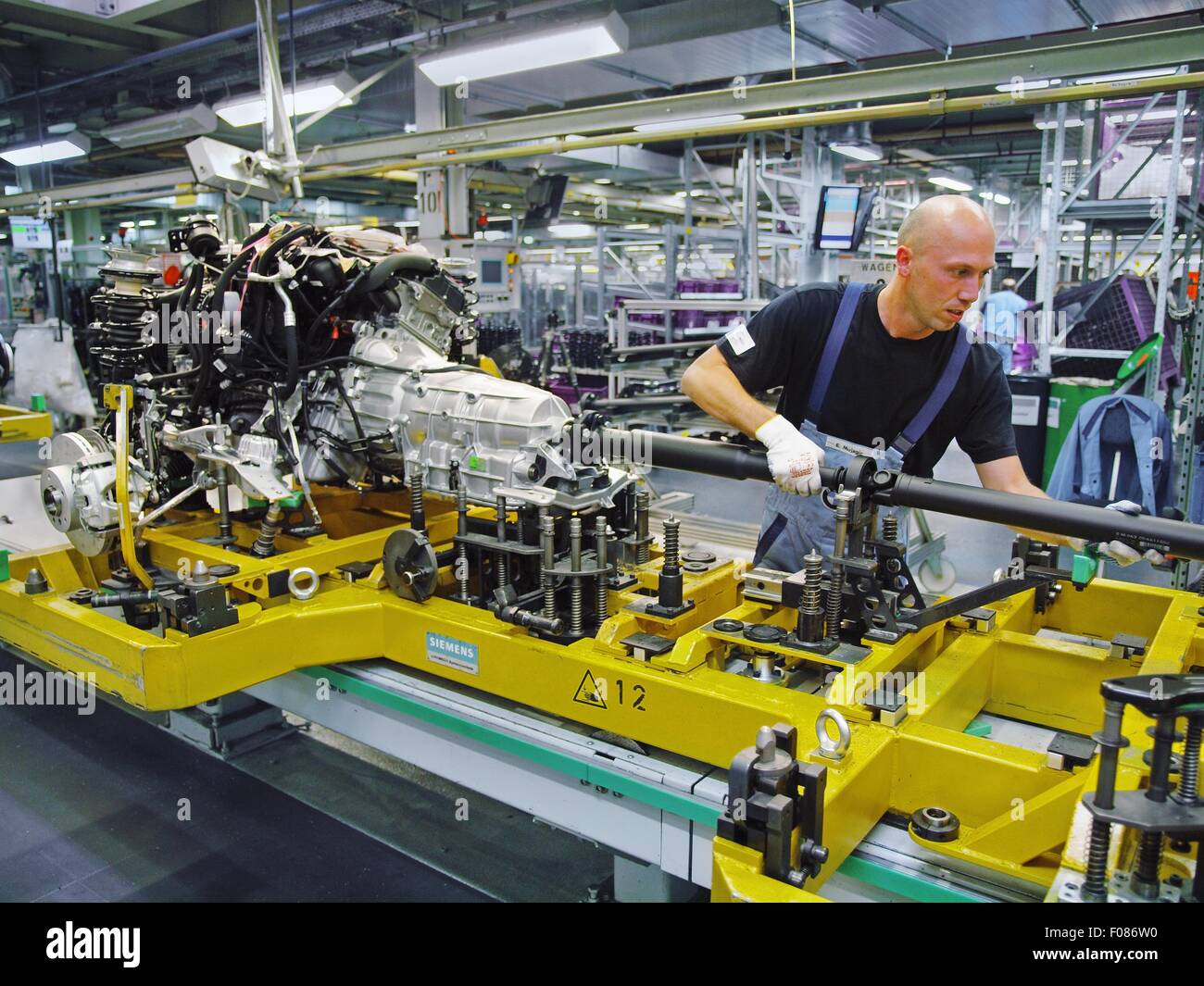 Technician assembling an engine in BMW World, Munich, Germany Stock ...