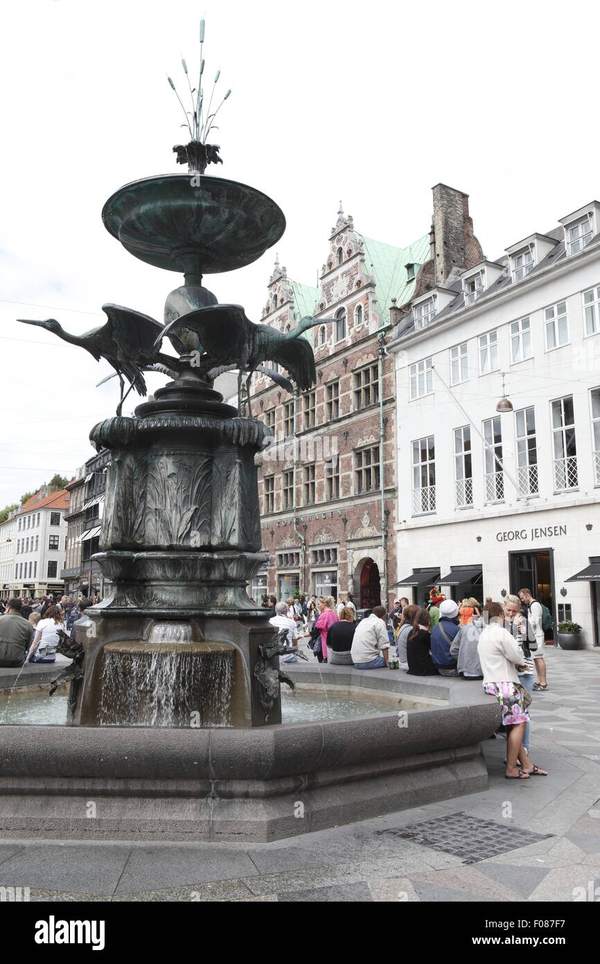 Tourist around Stork Fountain and Amager Square in Copenhagen, Denmark ...