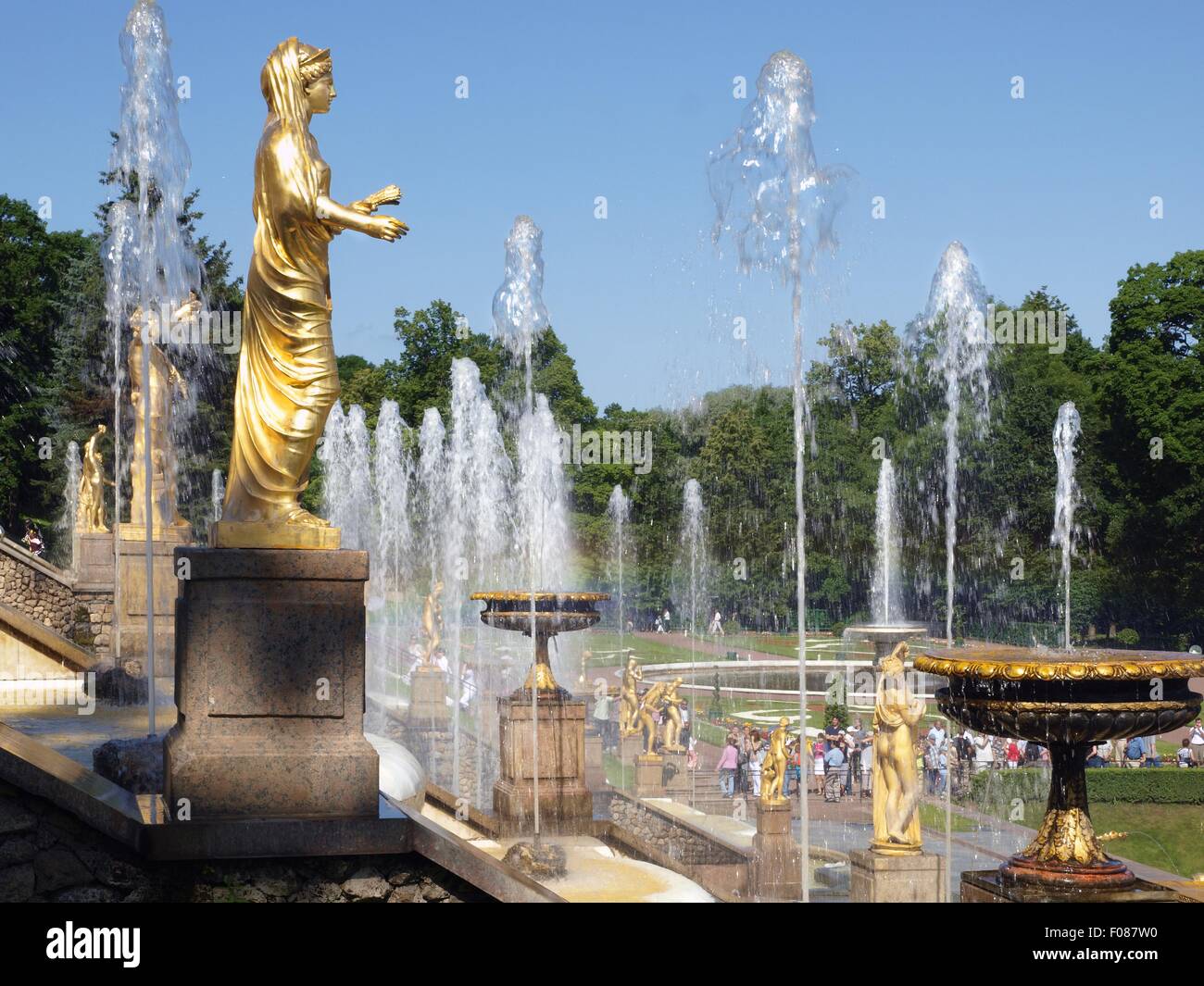 View of Peterhof Grand Cascade fountain with bronze sculptures in St ...