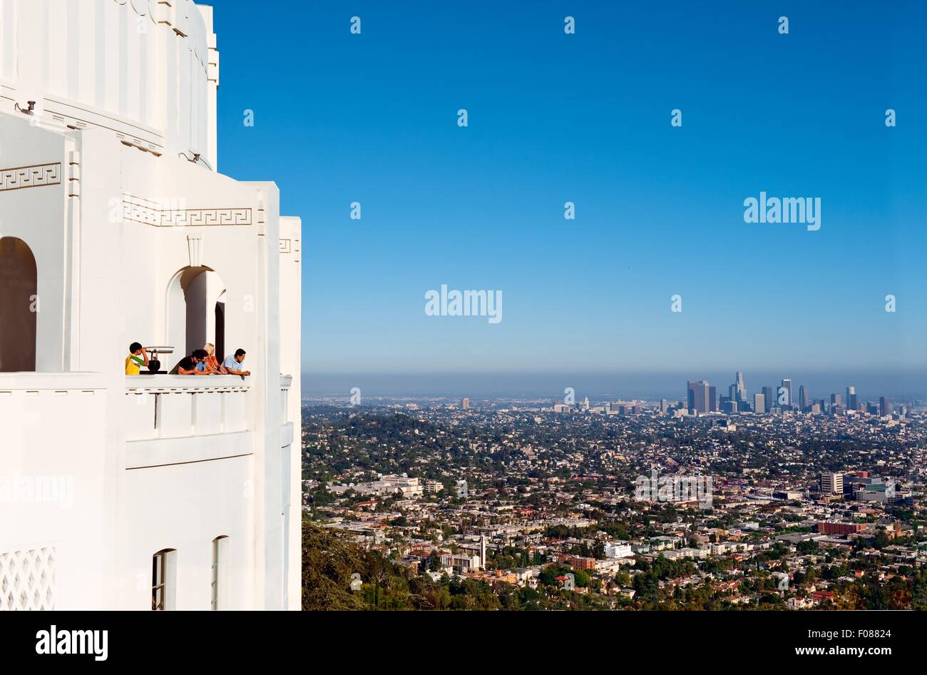 Tourist looking at cityscape from balcony, Los Angeles, California, USA ...