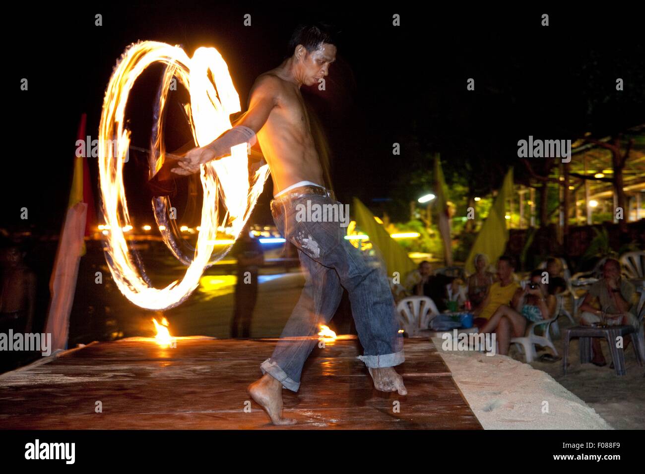 Torch dancers performing on stage at night, Thailand Stock Photo - Alamy