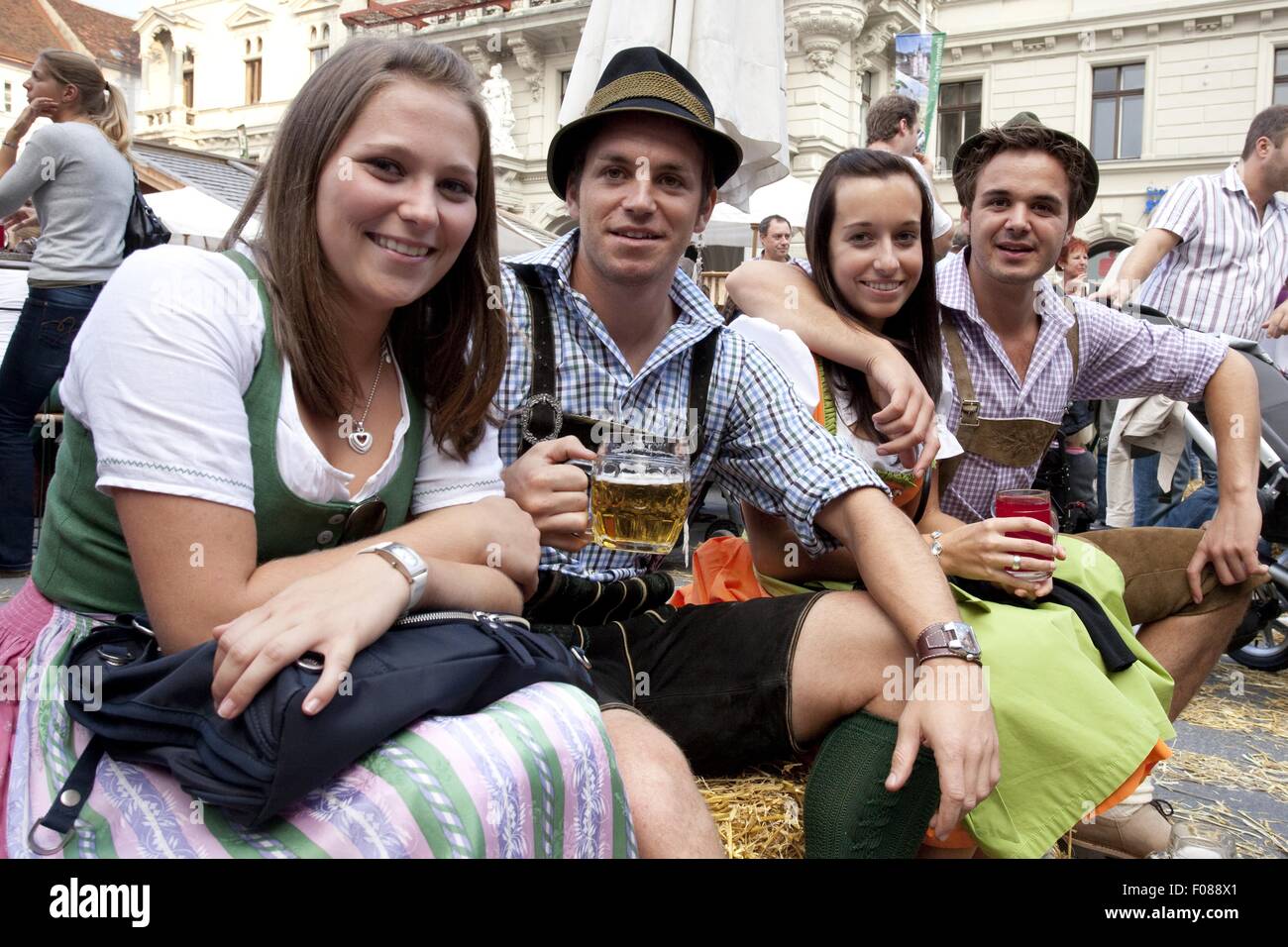 Portrait of men and women celebrating Aufsteirern Festival in Graz ...