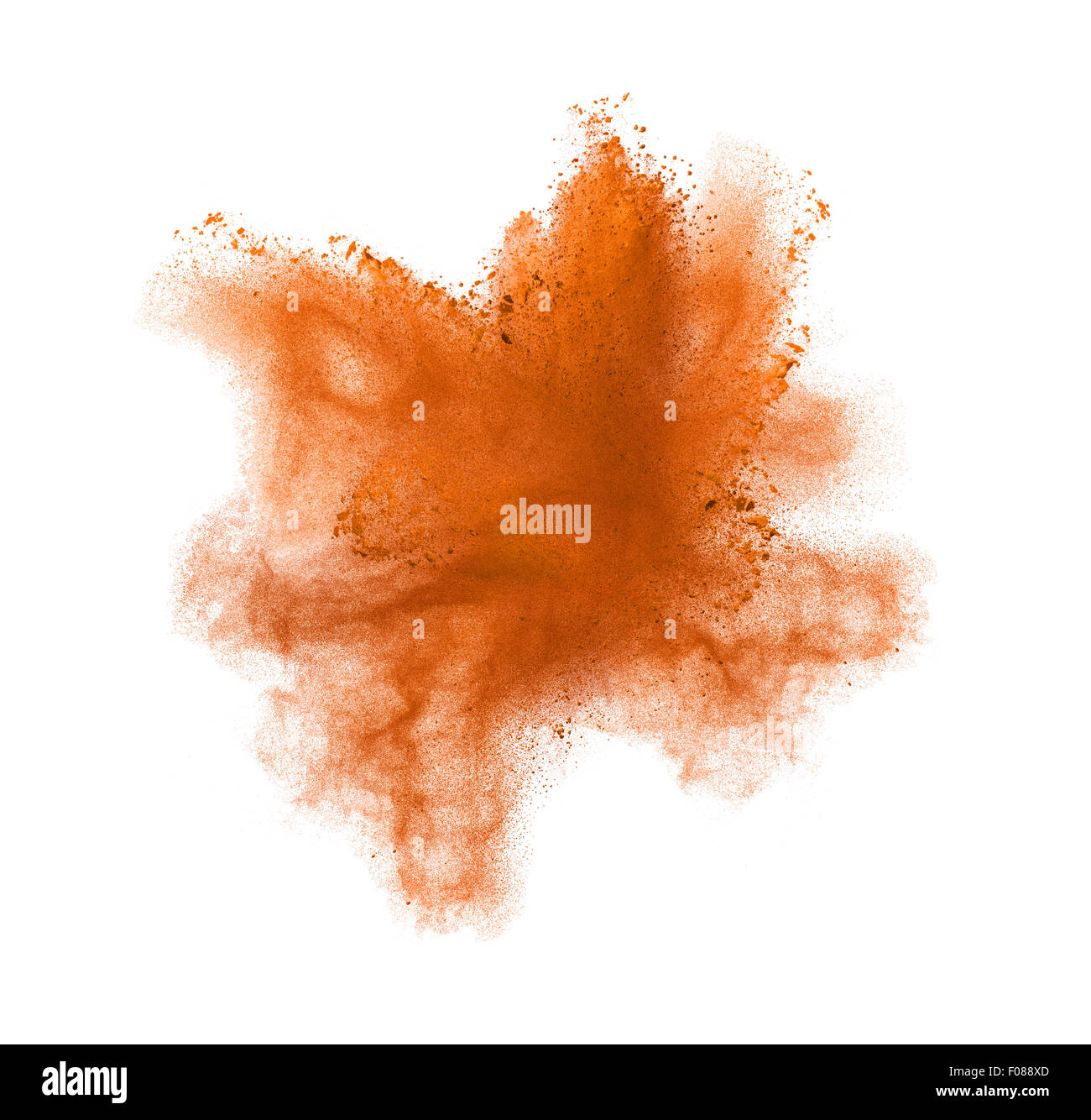 Freeze motion of Orange powder exploding, isolated on white. Abstract ...