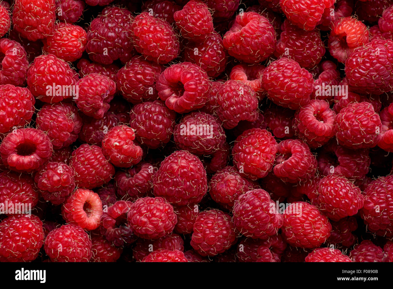 Ripe red raspberry fruit background. Top view Stock Photo - Alamy