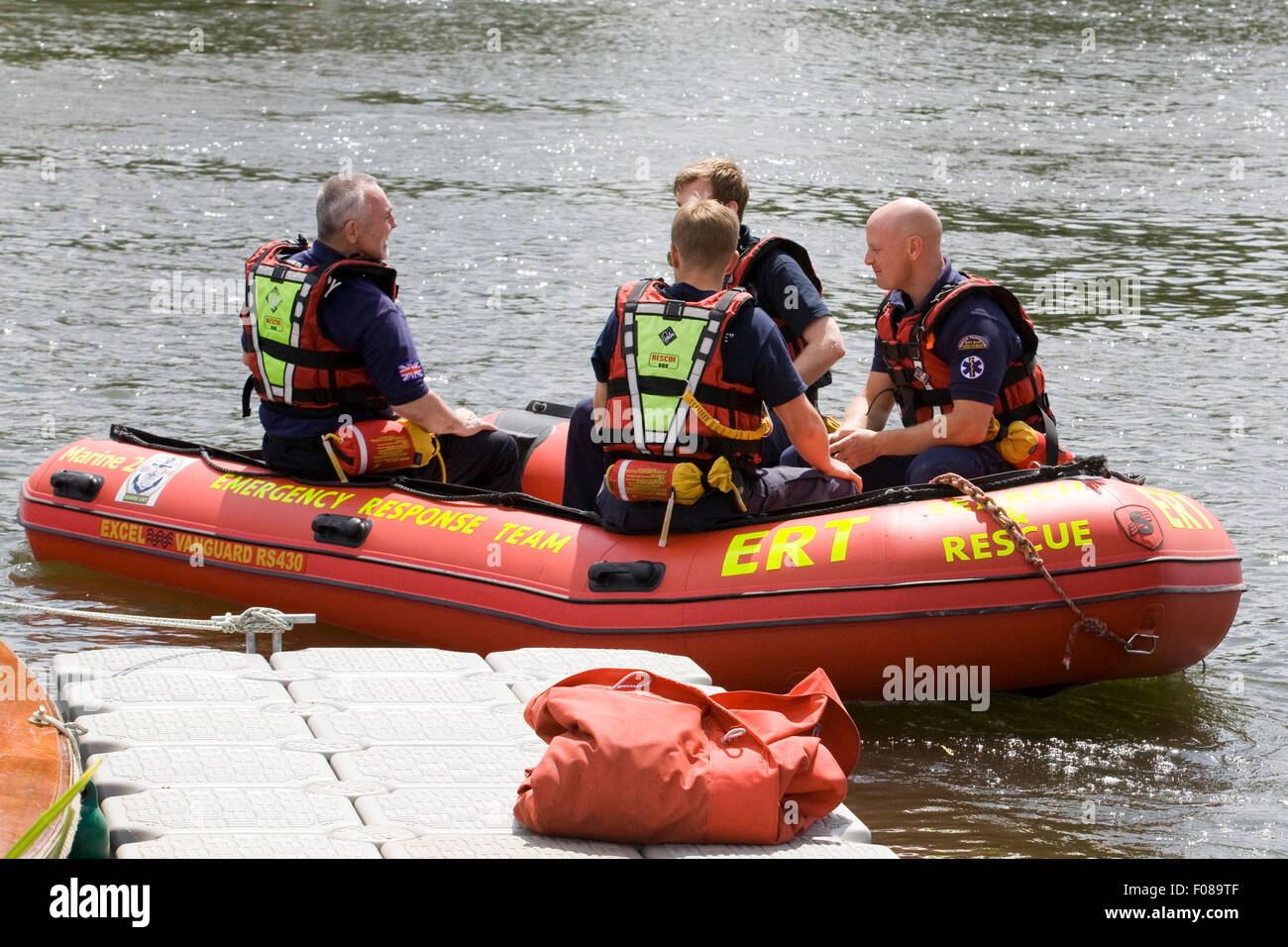 Emergency response Unit in a motorized dingy on the water at the ...
