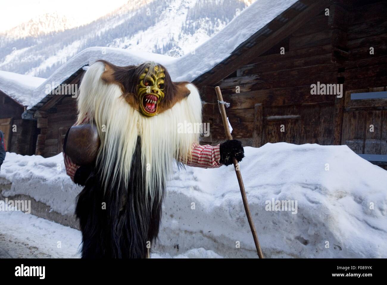 Person wearing costume and fasnacht mask in Loetschental, Switzerland ...