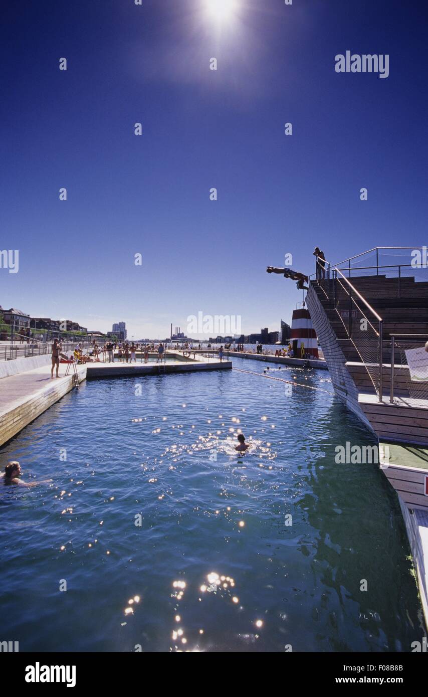People relaxing at outdoor swimming pool in Kongens Enghave, Copenhagen ...
