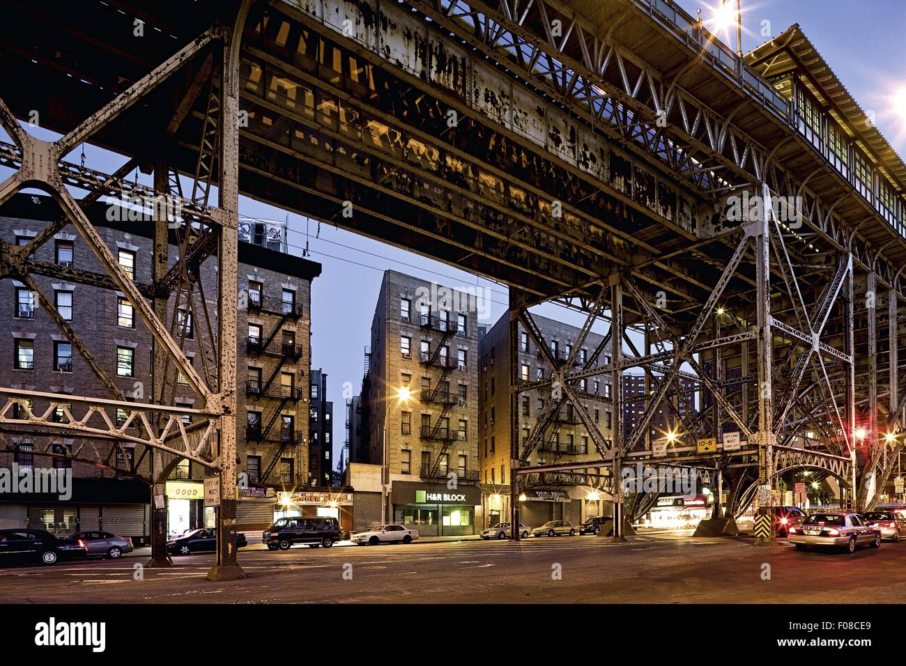 Facade of Harlem building and steel beam mill with lights at dusk, New ...