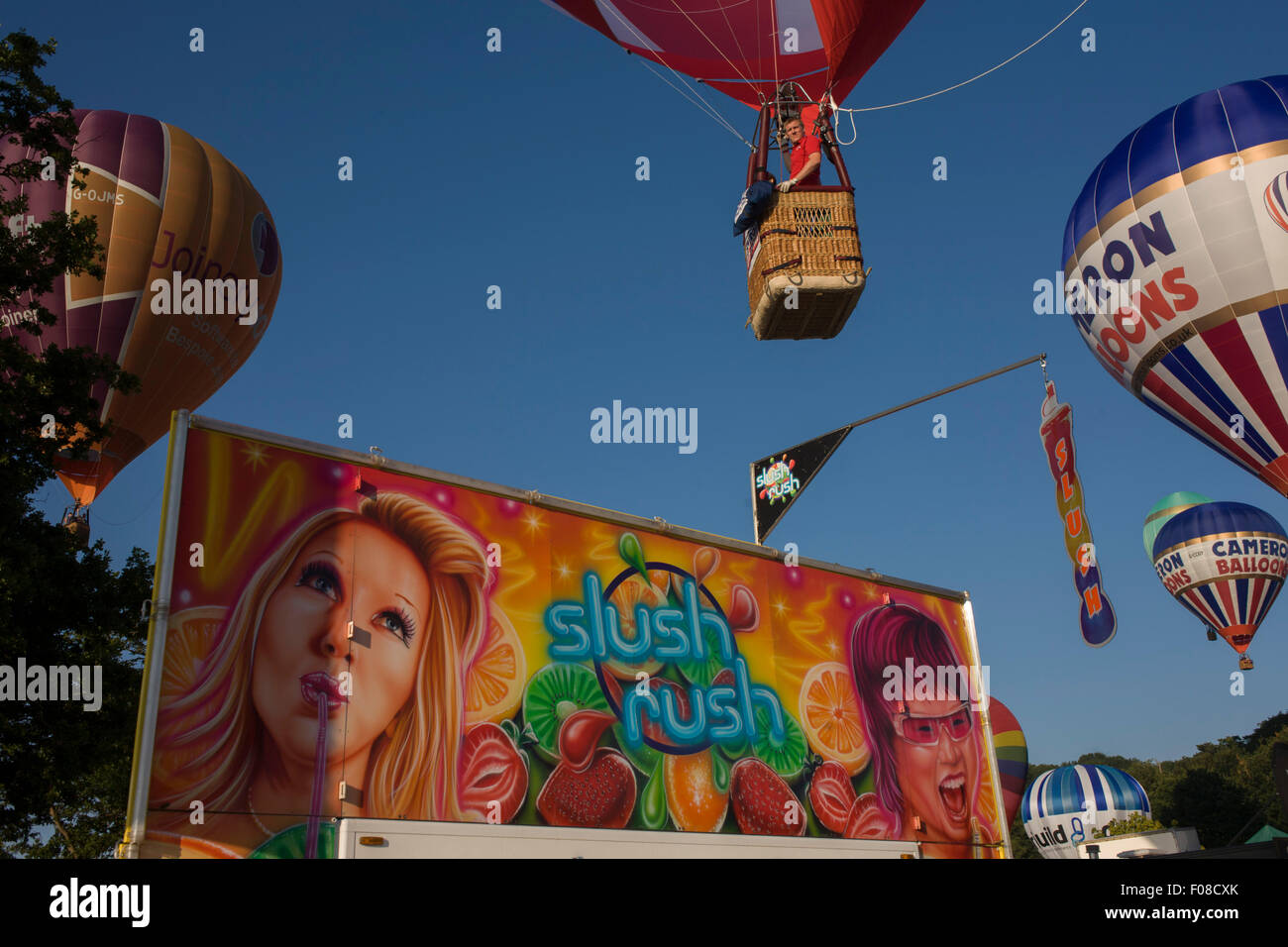 Balloons float overhead during the mass lift-off by balloons at ...