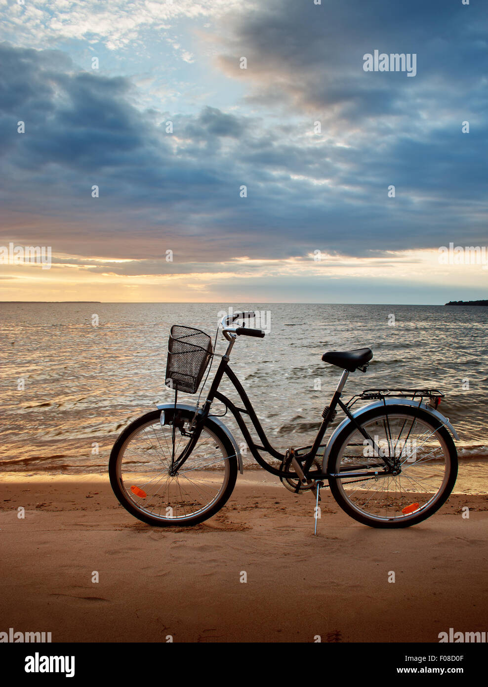 Lonely bike standing at sunset Stock Photo - Alamy