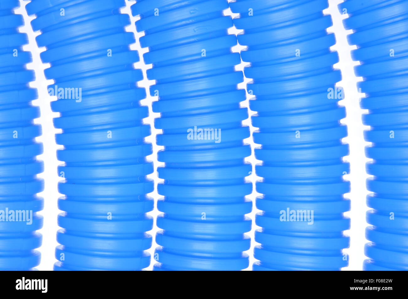 Blue plastic corrugated pipes isolated on white background Stock Photo ...