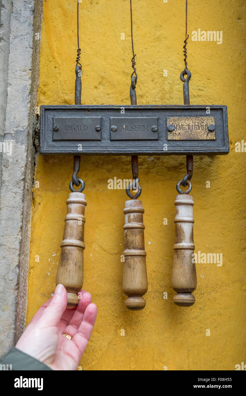 Wire operated door bells with wooden handles Stock Photo - Alamy