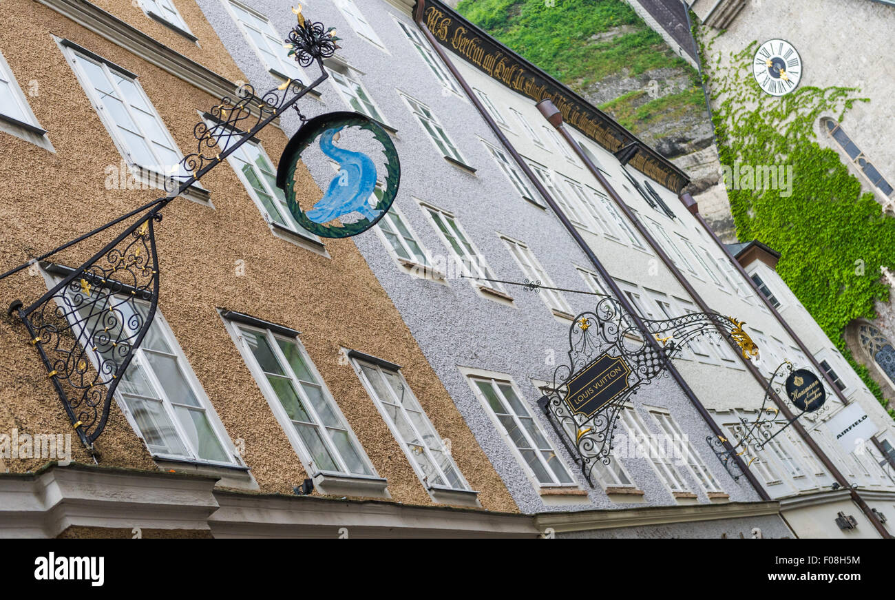 The ornate shop signs on the Getreidegasse in Salzburg, Austria Stock ...