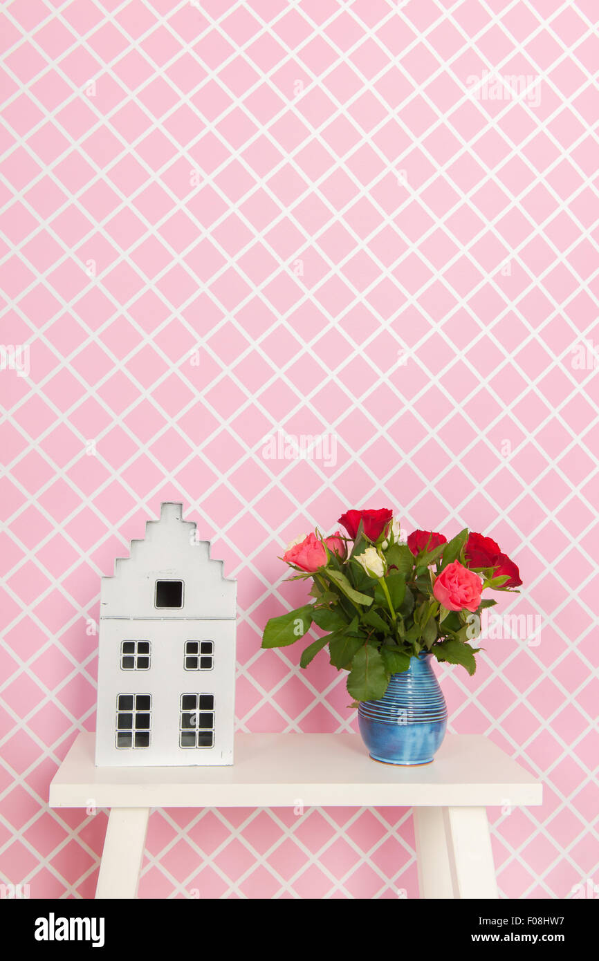Flowers and decoration in pink interior Stock Photo - Alamy