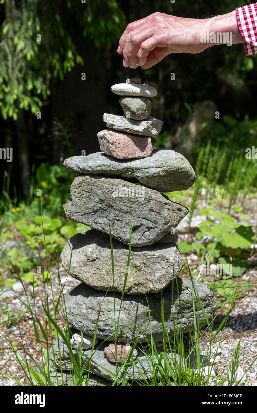 Placing stones hi-res stock photography and images - Alamy