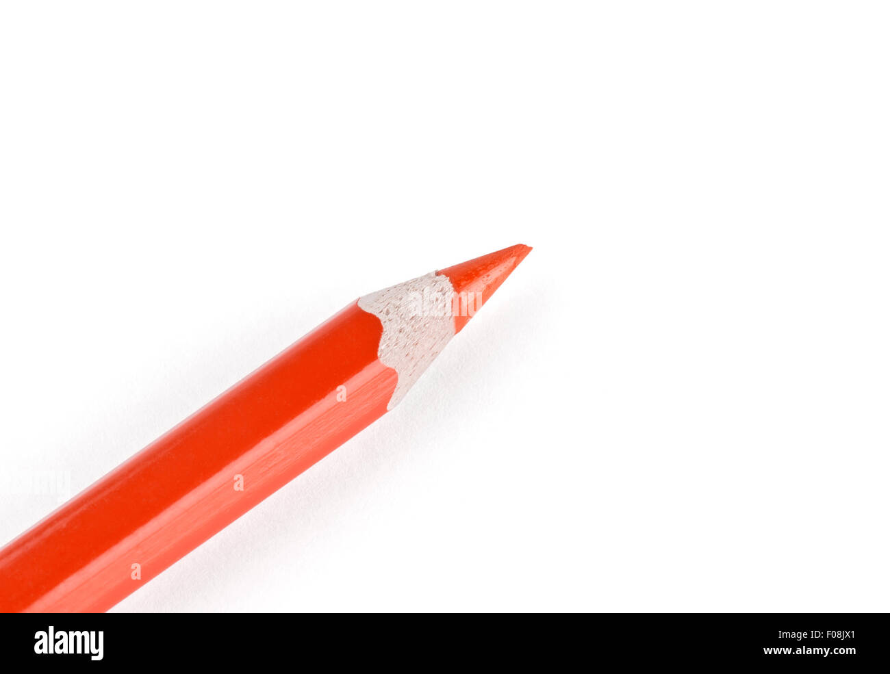 Red pencil on white background close up Stock Photo - Alamy