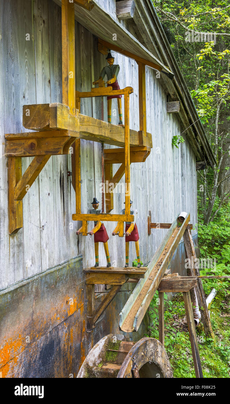 Small scale water powered saw mill driving a water wheel and operating ...