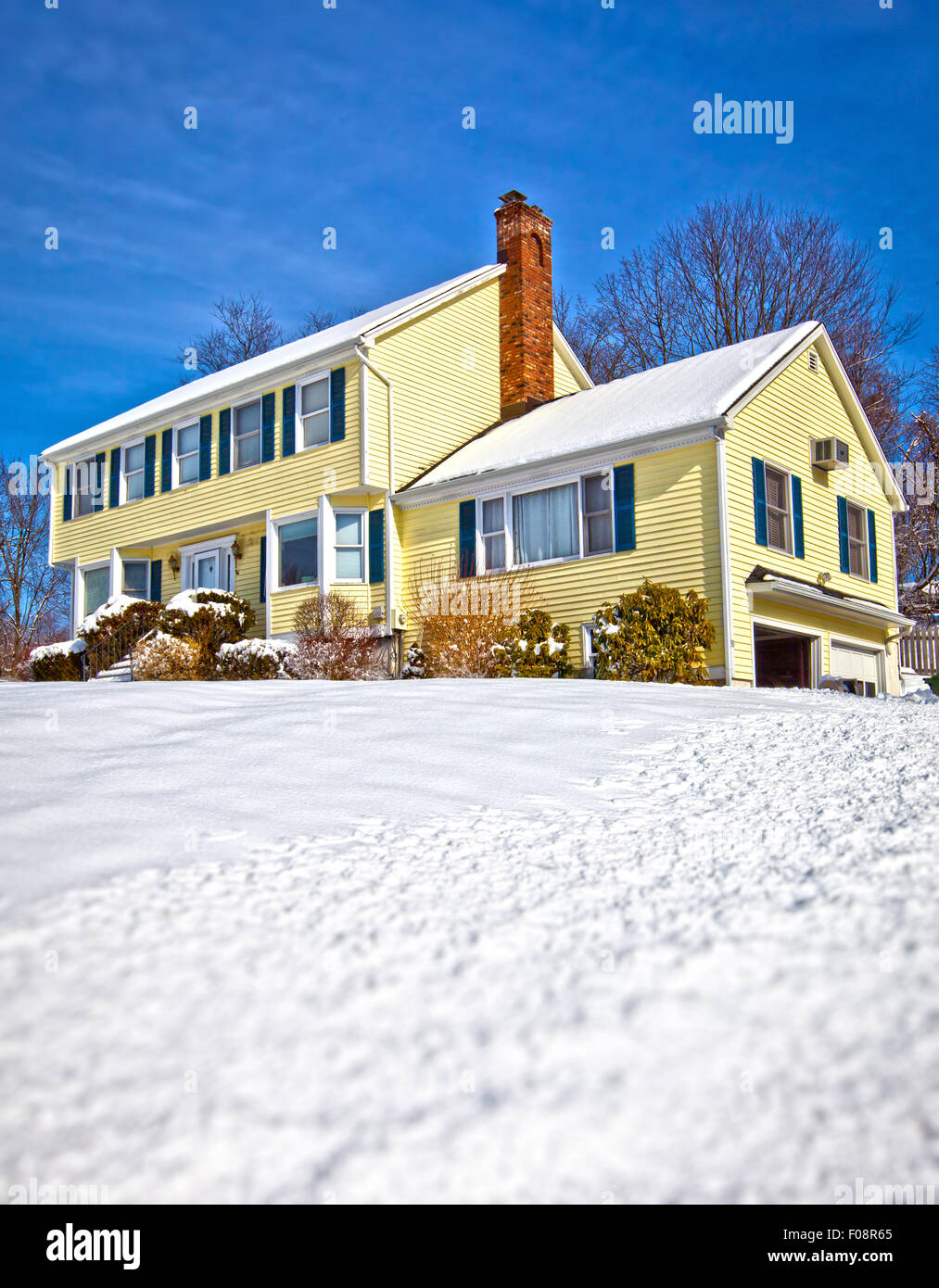 Typical colonial style house in deep snow and ice Stock Photo - Alamy