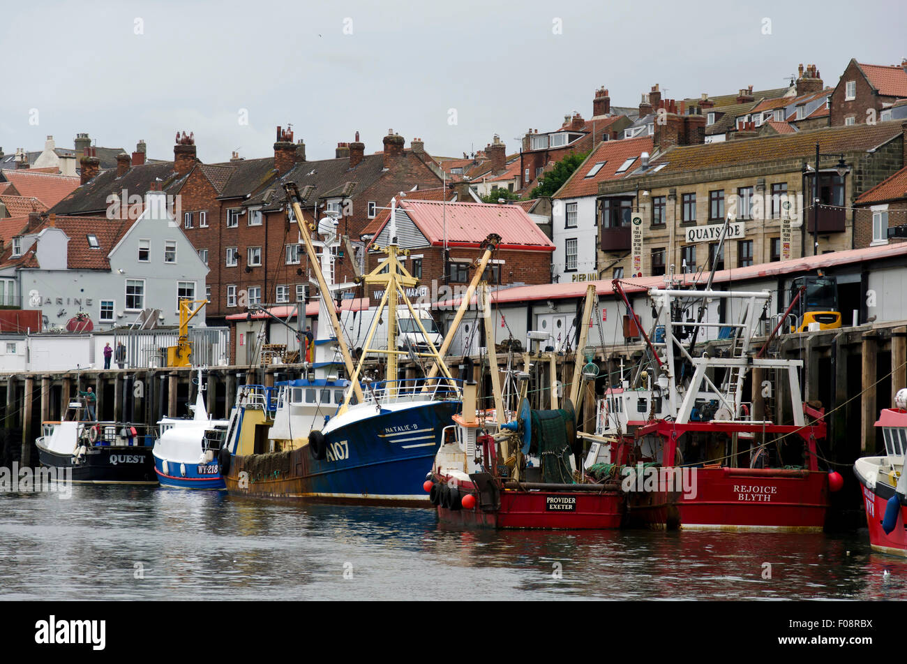 Fishing boats moored in the outer harbour of Whitby in North Yorkshire ...