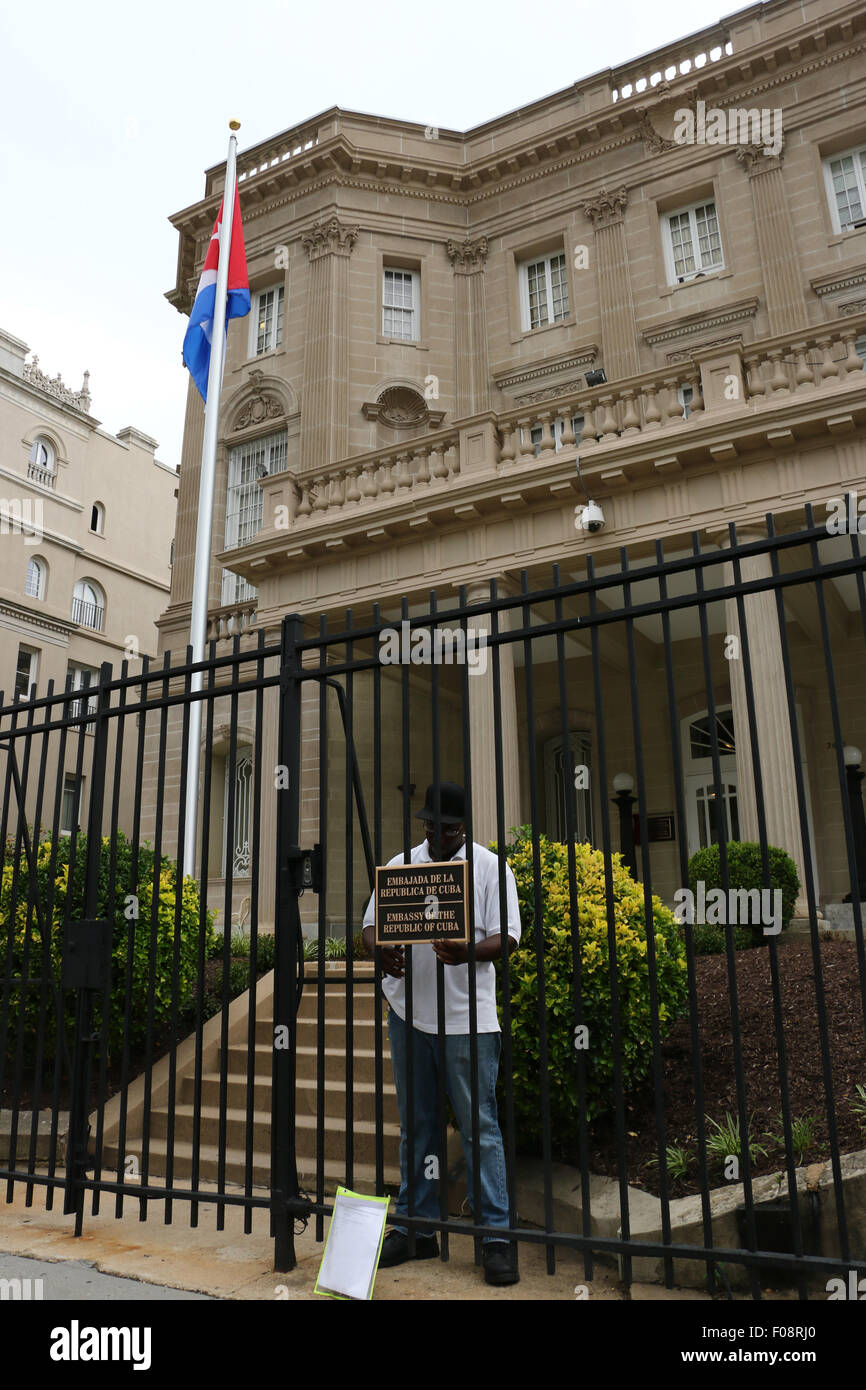 Worker installing sign New Cuban embassy Washington D C Stock Photo - Alamy