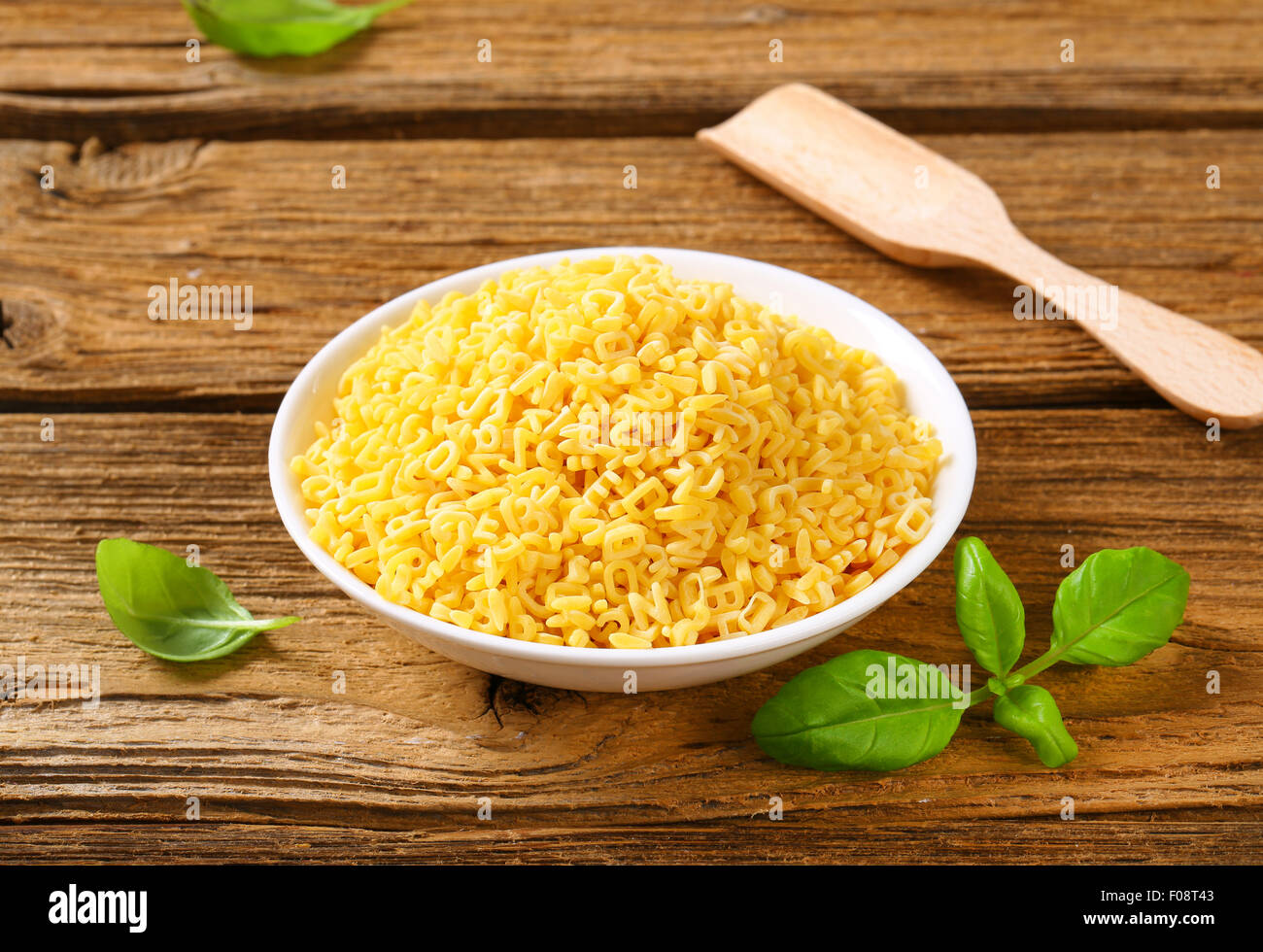 Plate of small letter-shaped pasta Stock Photo - Alamy