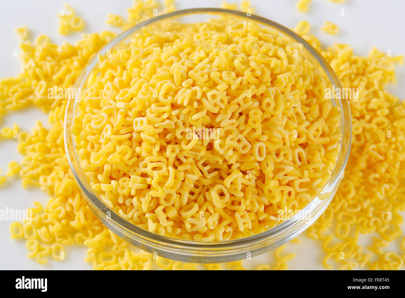 Bowl of small letter-shaped pasta Stock Photo - Alamy